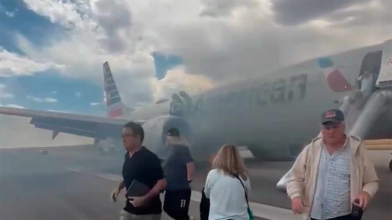 Video shows moment American Airlines plane's landing gear catches fire ...