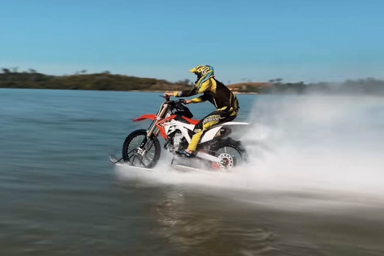 Impressive video shows man riding a motorcycle over river waters in ...